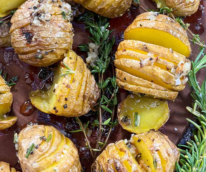 Grilled Mini Hasselback Potatoes with Garlic Herb Butter - Girls Can Grill